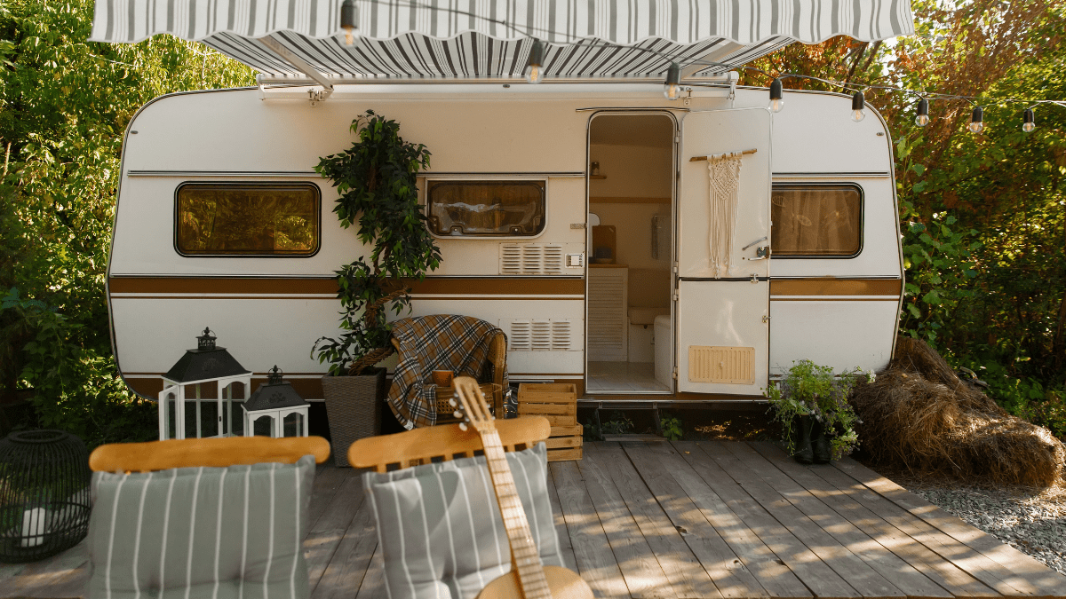 RV campervan with picnic chairs outside - Air Head Composting Toilet ...